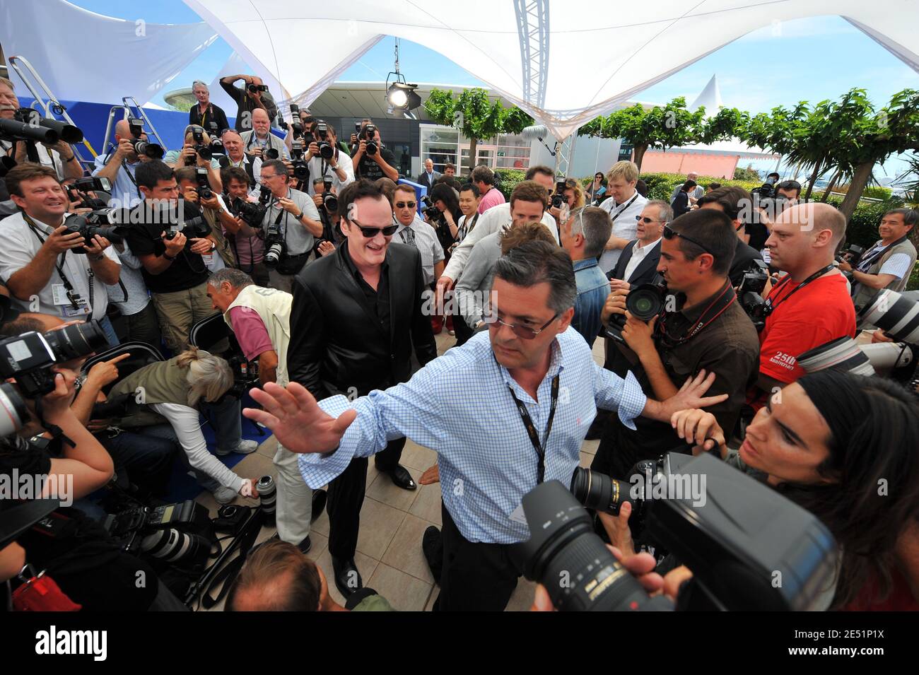 Director Quentin Tarantino poses amongst the photographers at a ...