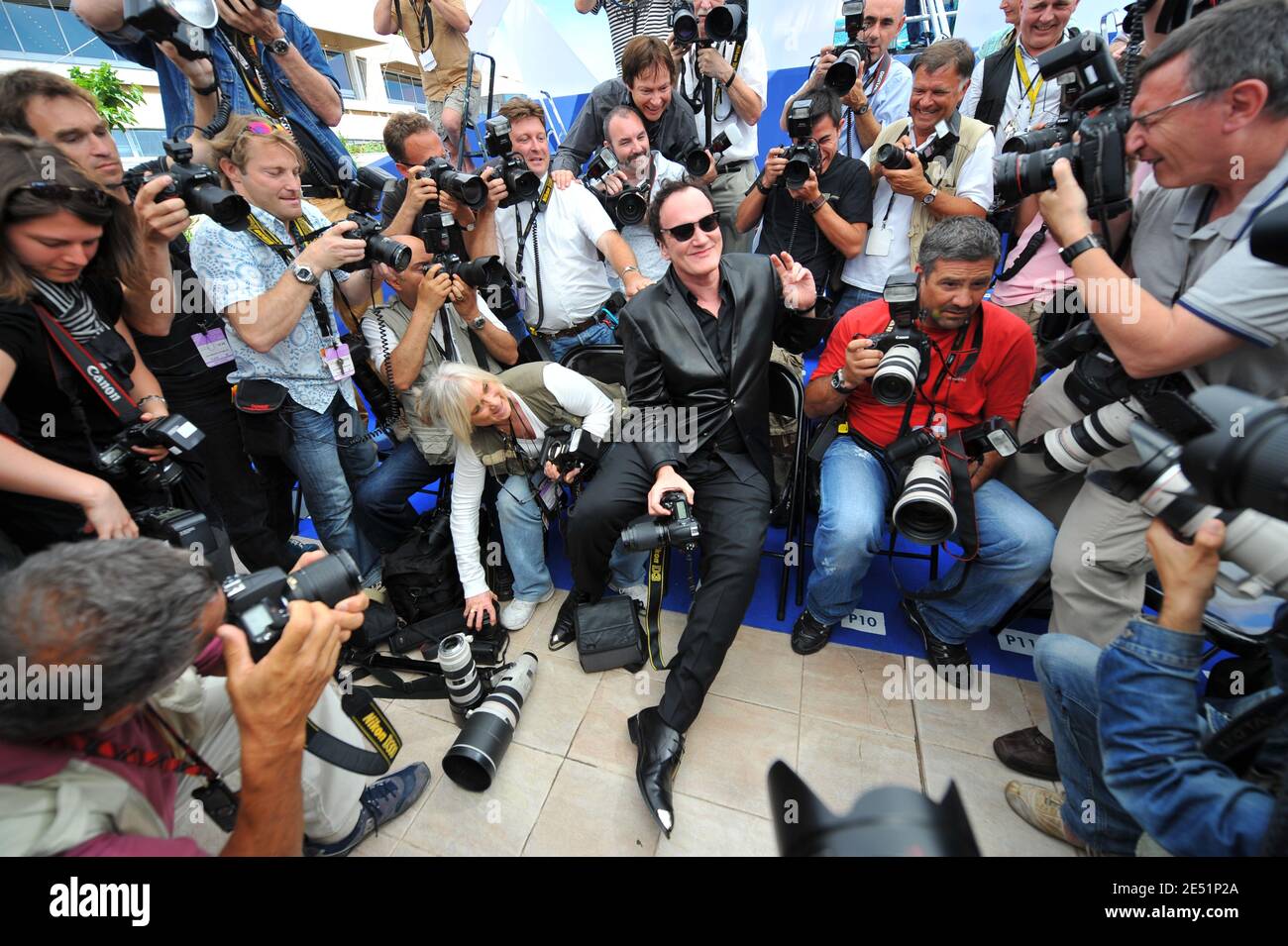 Director Quentin Tarantino poses amongst the photographers at a ...