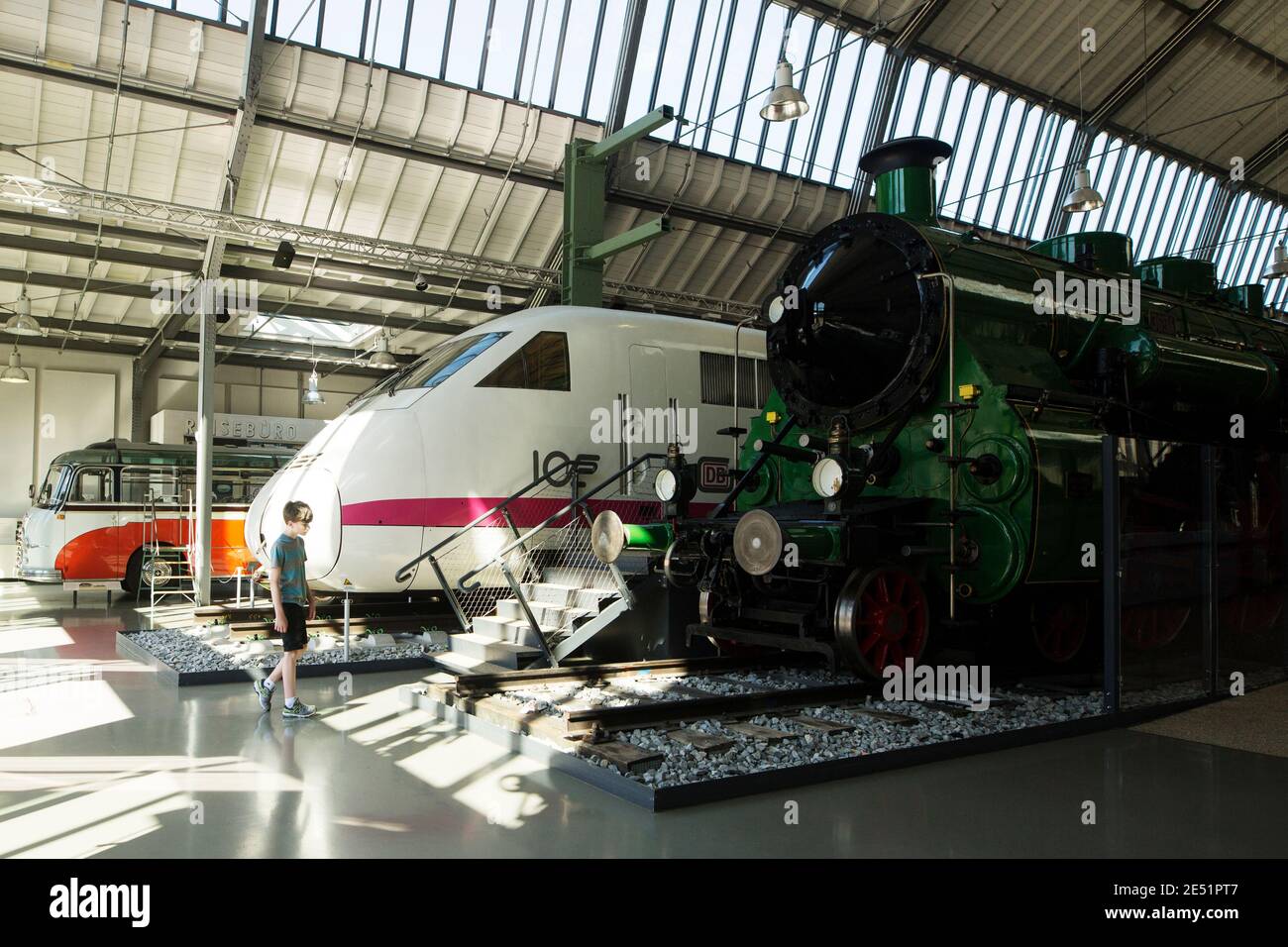 A thirteen-year-old boy looks at the historic and modern trains on ...