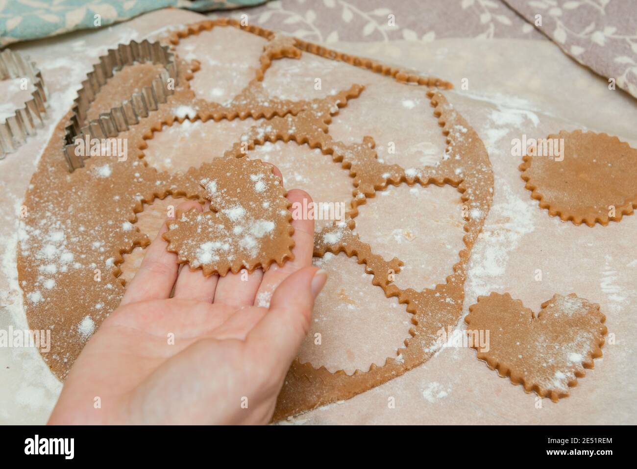 Process of cutting cookies by cookie cutters. Woman making by hands ...