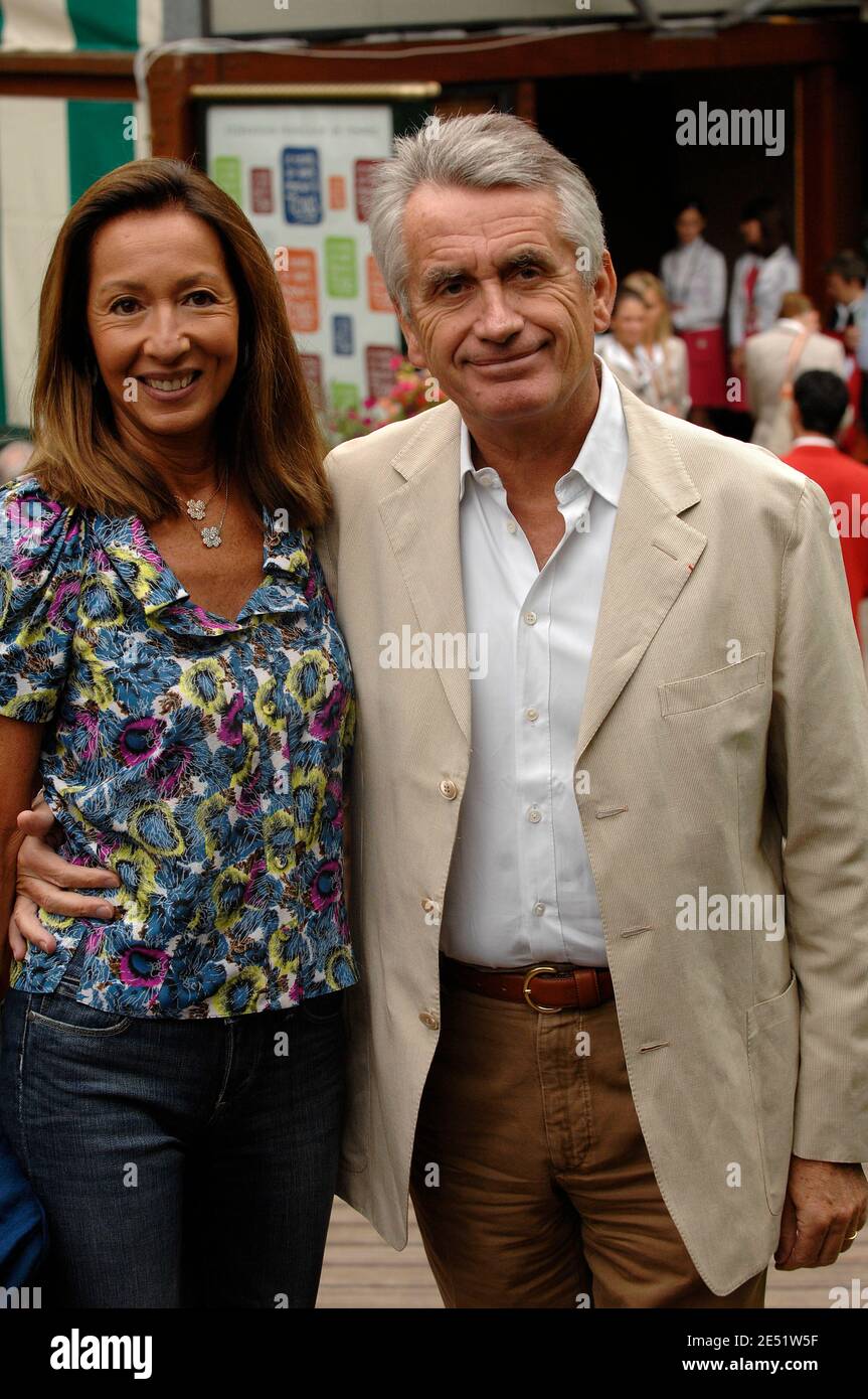 French producer Gilbert Coullier and his wife arrive for lunch at the ...