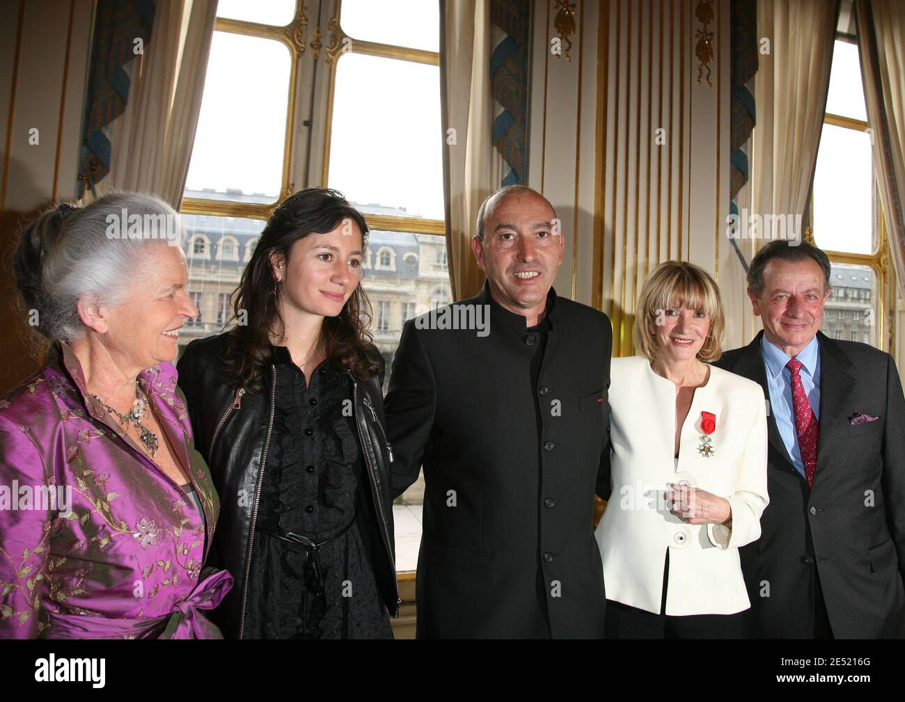 Eve Ruggieri (here with husband and daughter Marion) receives the medal ...