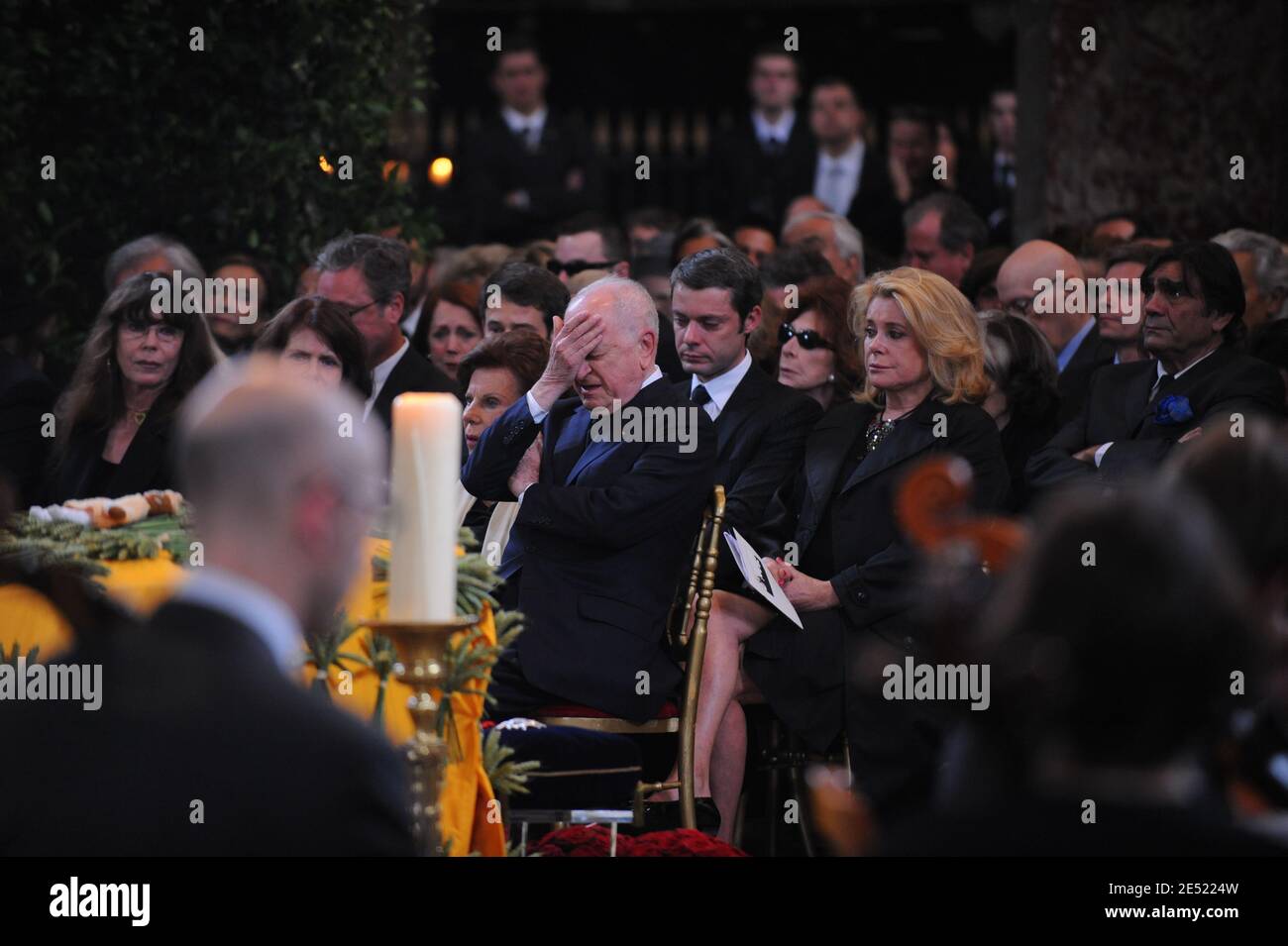 Pierre Berge and Catherine Deneuve attend at the Saint-Roch church in ...