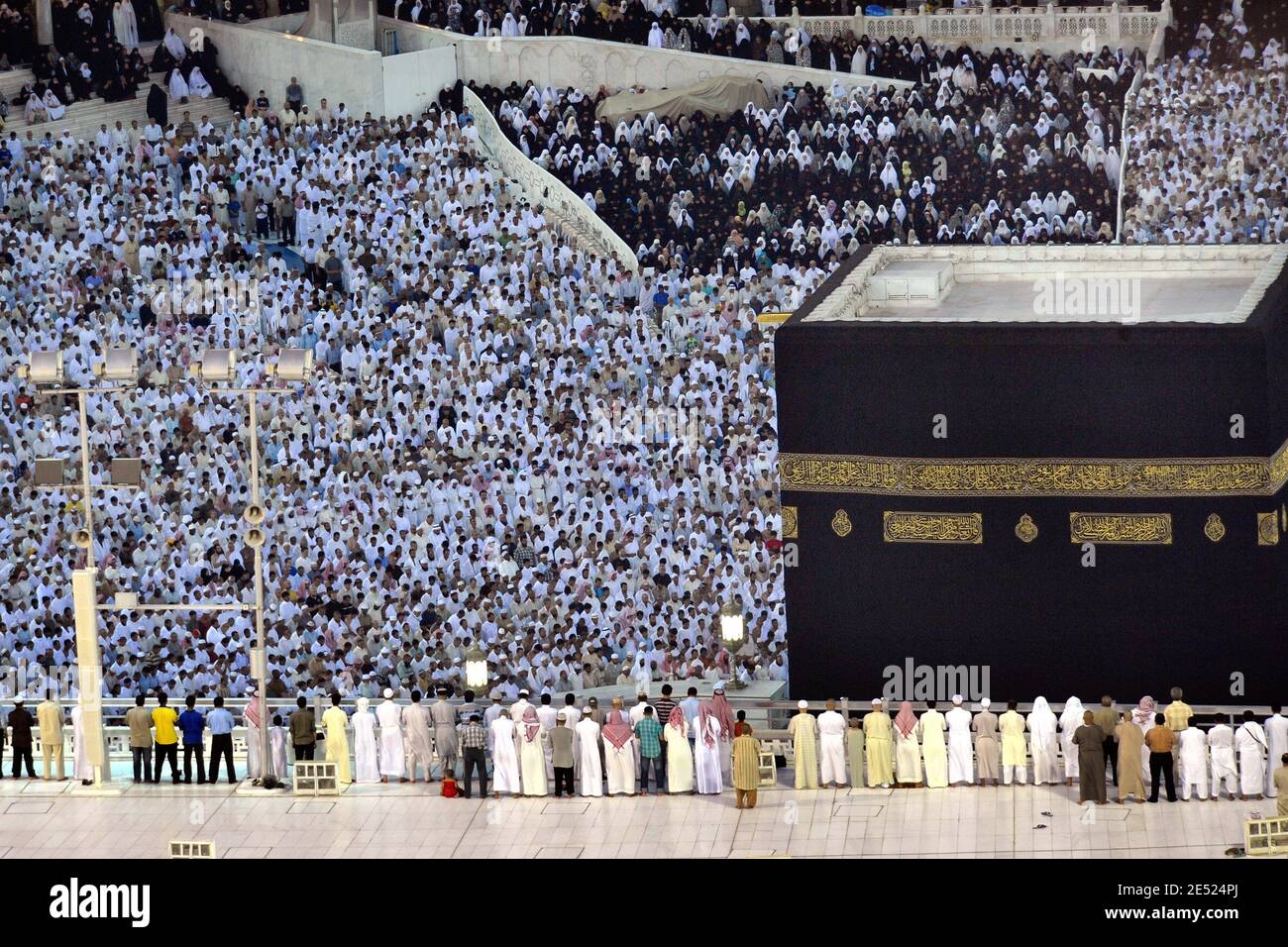Prayers are seen inside the Great Mosque surrounding the 'kaaba', or ...