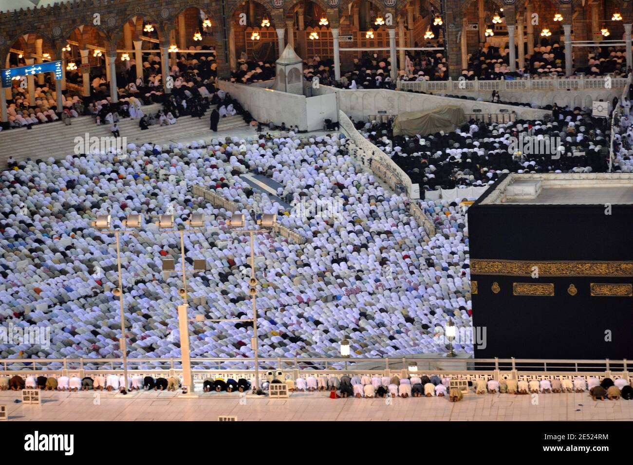 Prayers are seen inside the Great Mosque surrounding the 'kaaba', or ...