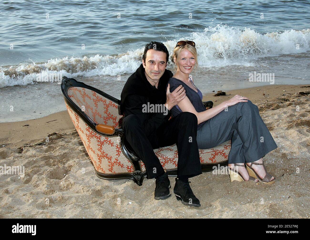 Sophie Broustal and her husband Bruno Todeschini pose for photographers ...