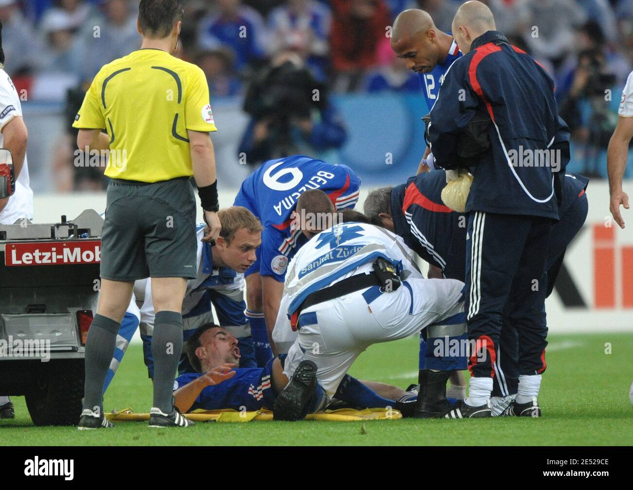 France's Franck Ribery is injured and his teammates Karim Benzema and ...