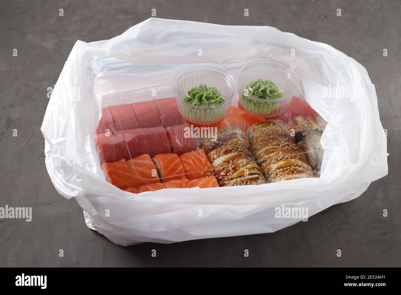 Sushi to go concept. Disposable food box with sushi rolls and ...