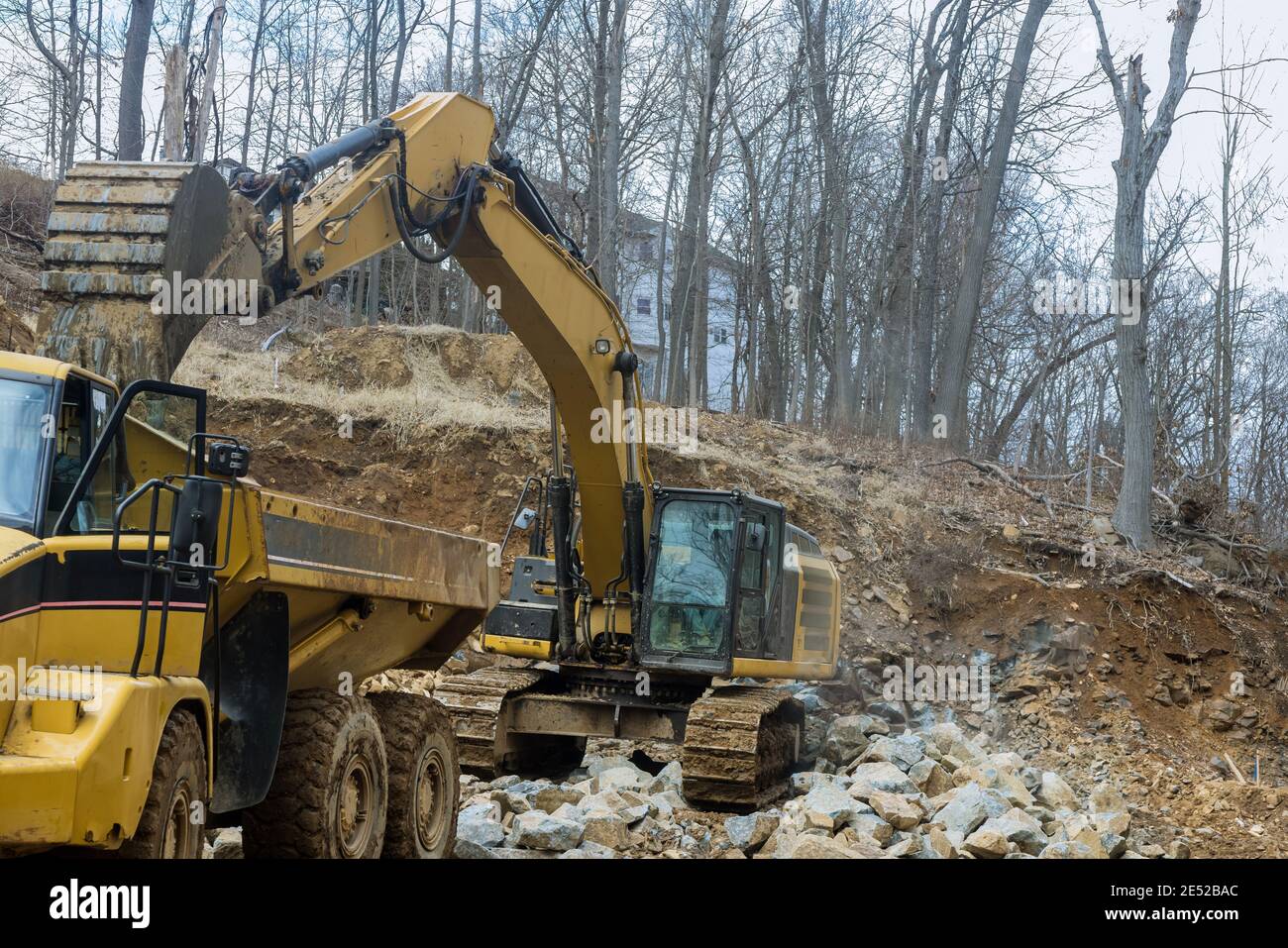 Loading bucket hydraulic excavator a stones the excavator is loading ...