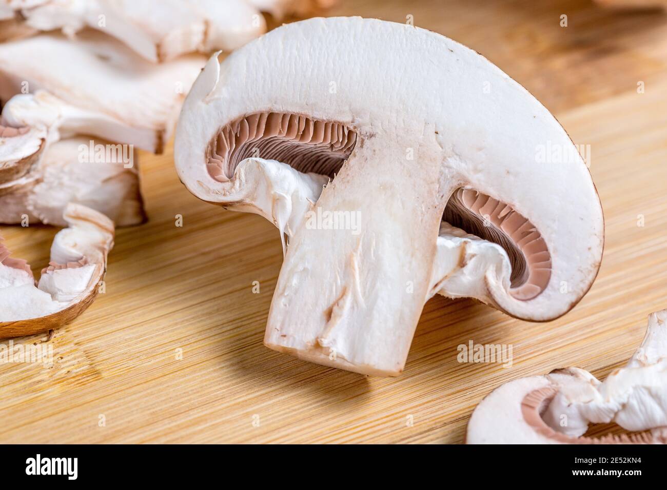 Close-up of a slice of edible mushroom on a cutting board Stock Photo ...