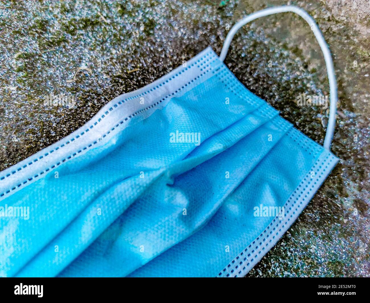 Surgical blue masks on the ground. Corona virus pollution in Costa Rica ...