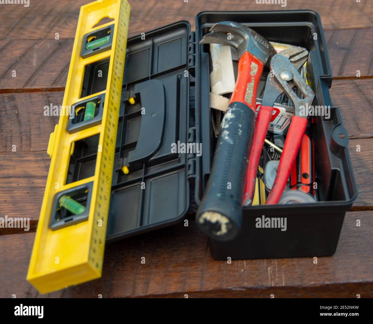 Equipment in a tool box: Hammer, ruler, screwdriver, wrench, nails ...