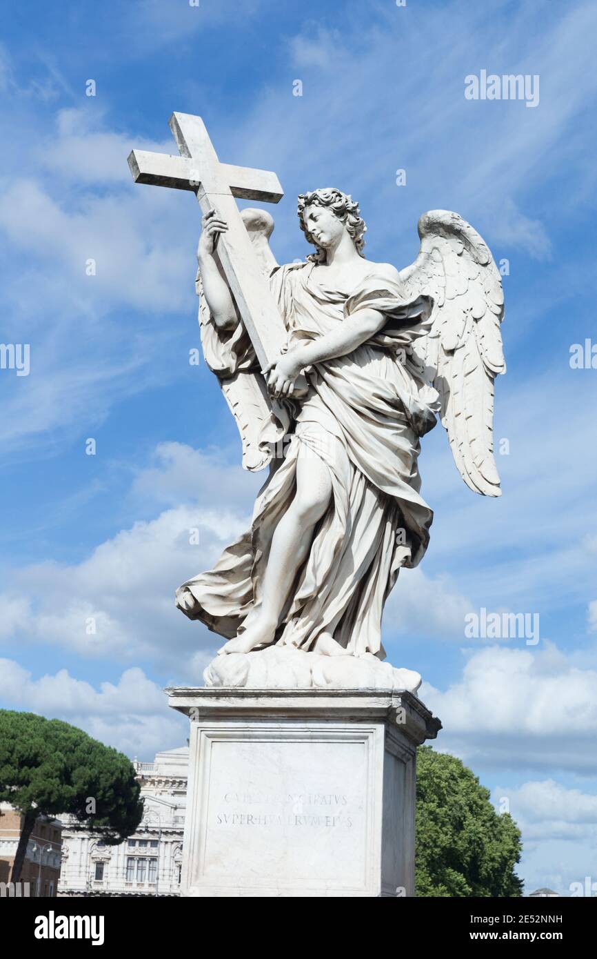 Italy Rome Angel with the Cross on St. Angelo Bridge against a cloudy ...