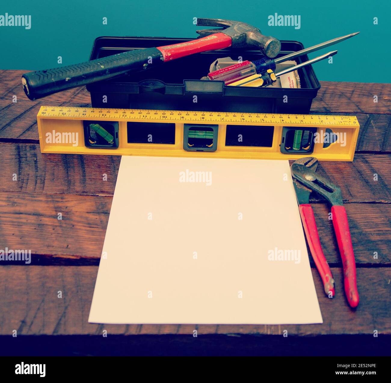 Toolbox with tools laid out on a table with white paper Stock Photo - Alamy