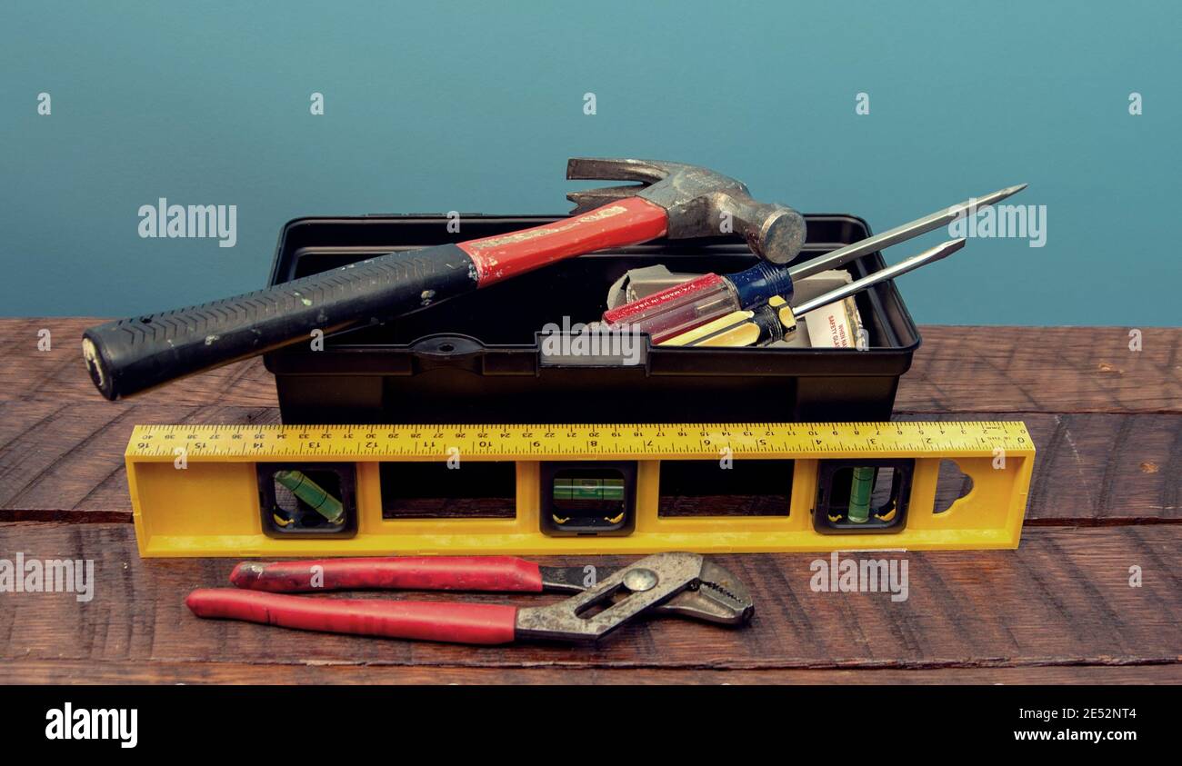 Equipment in a tool box: Hammer, ruler, screwdriver, wrench, nails ...