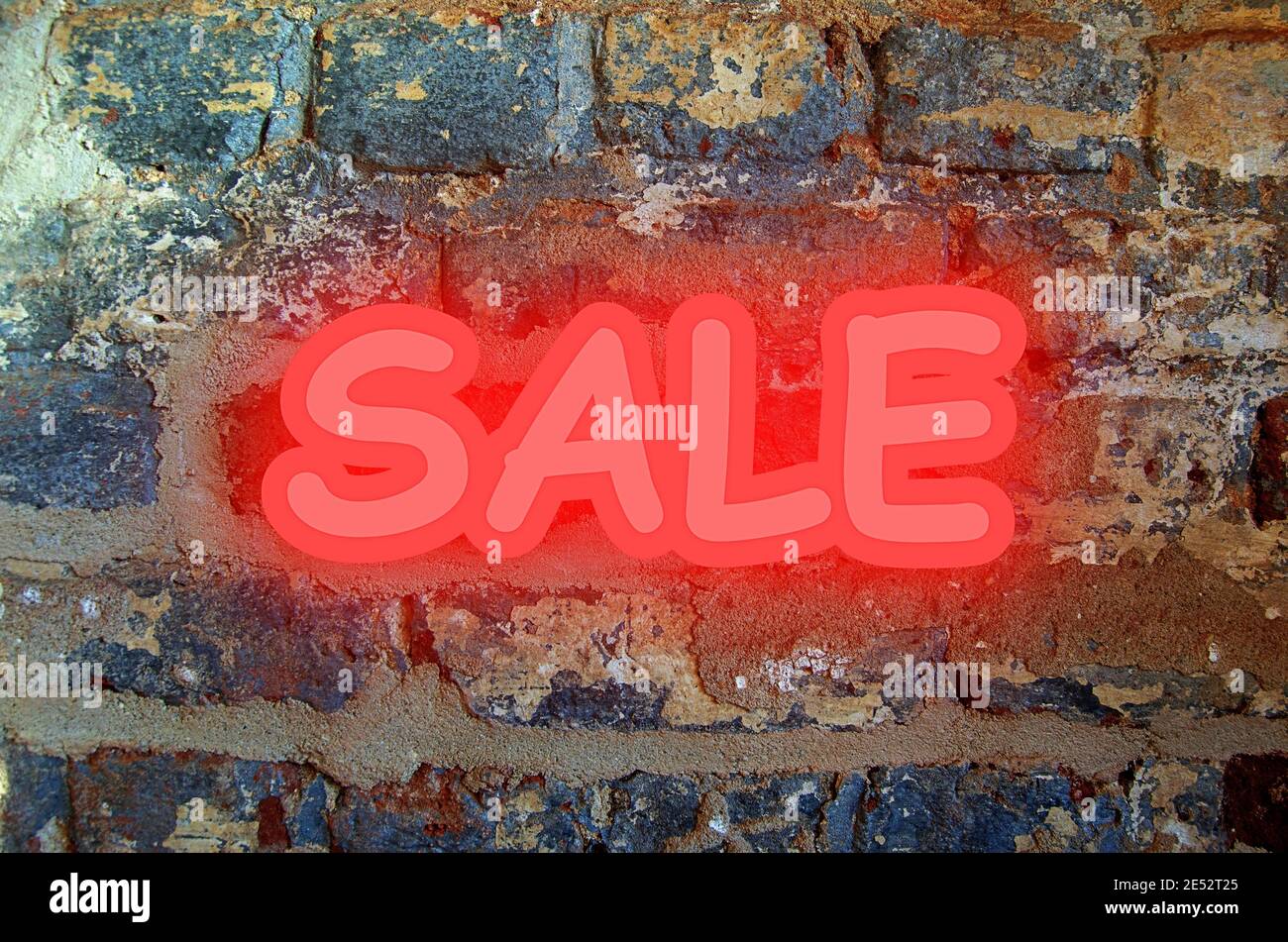 Neon Sign on a brick wall, a Sale sign Stock Photo - Alamy