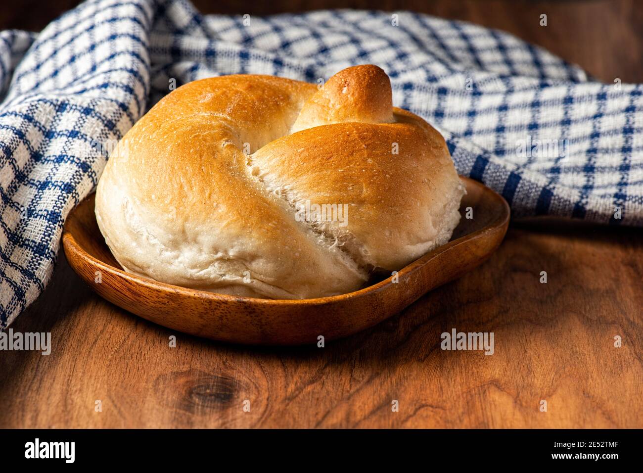Delicious fresh baked knot bread roll Stock Photo - Alamy