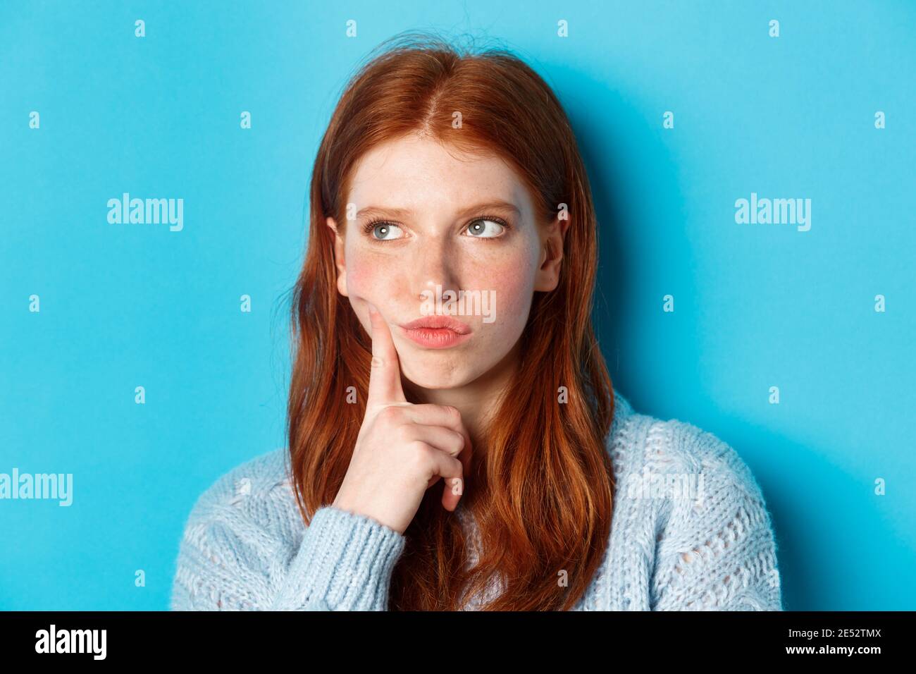 Headshot of troubled teenage girl thinking, looking bothered and ...