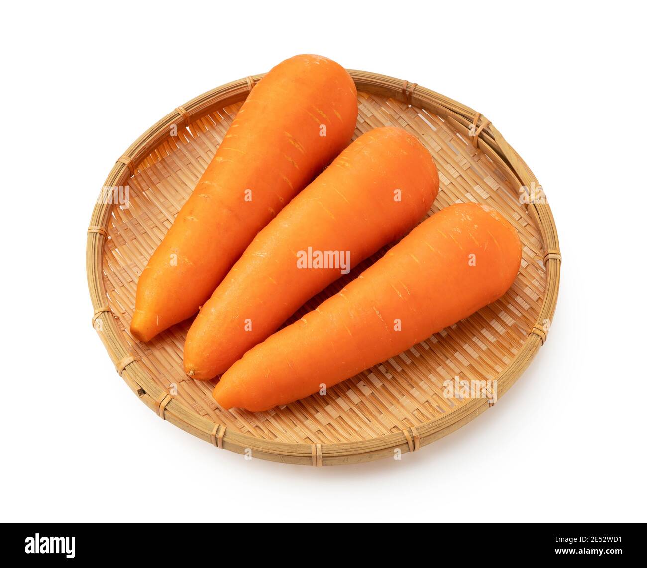 Three carrots on a white background Stock Photo - Alamy