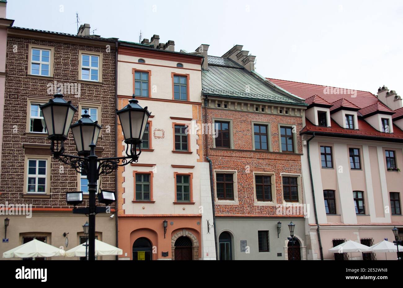 Masonry buildings facades in Krakow old town Stock Photo - Alamy