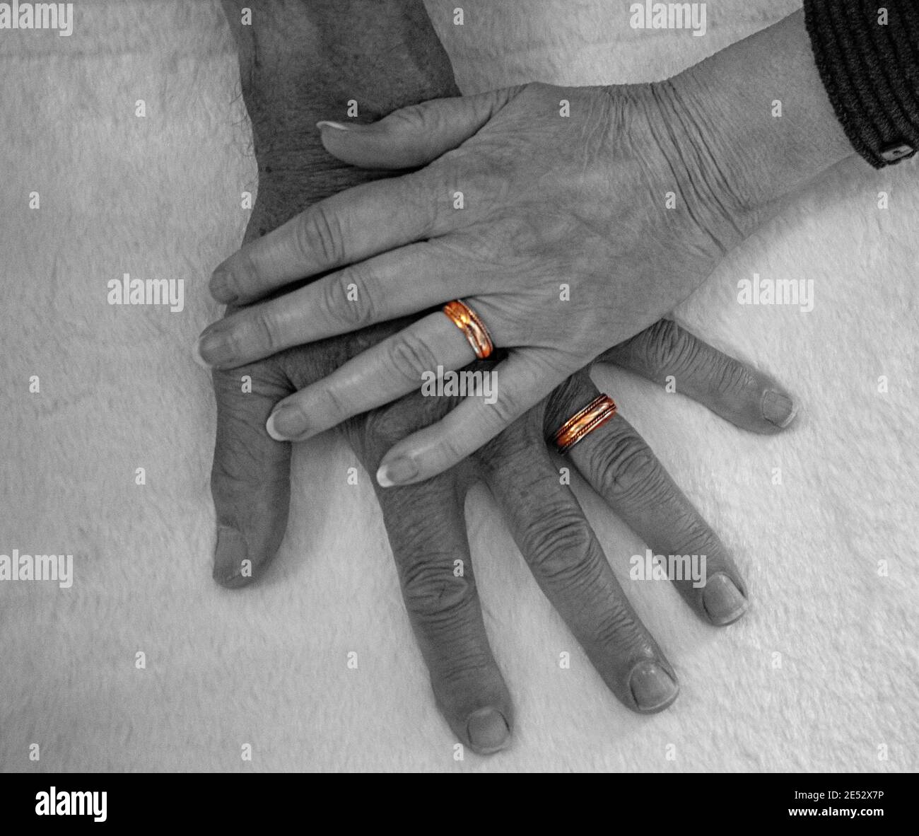 Older hands and wedding rings hi-res stock photography and images - Alamy