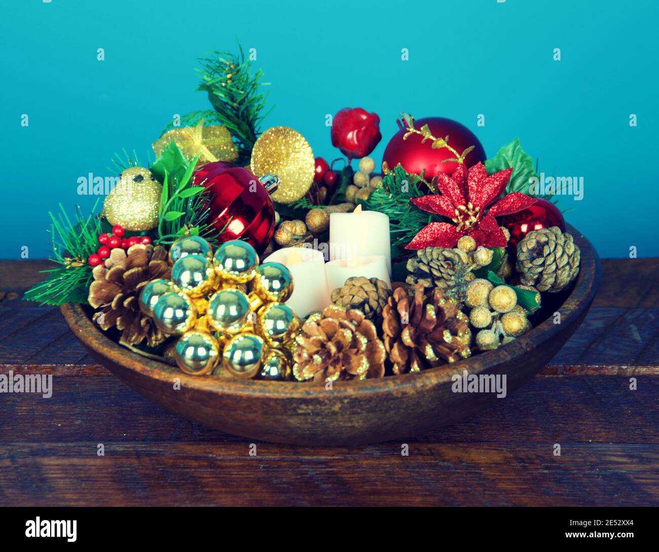 Christmas-related items on a reclaimed wood table and wooden bowl Stock ...
