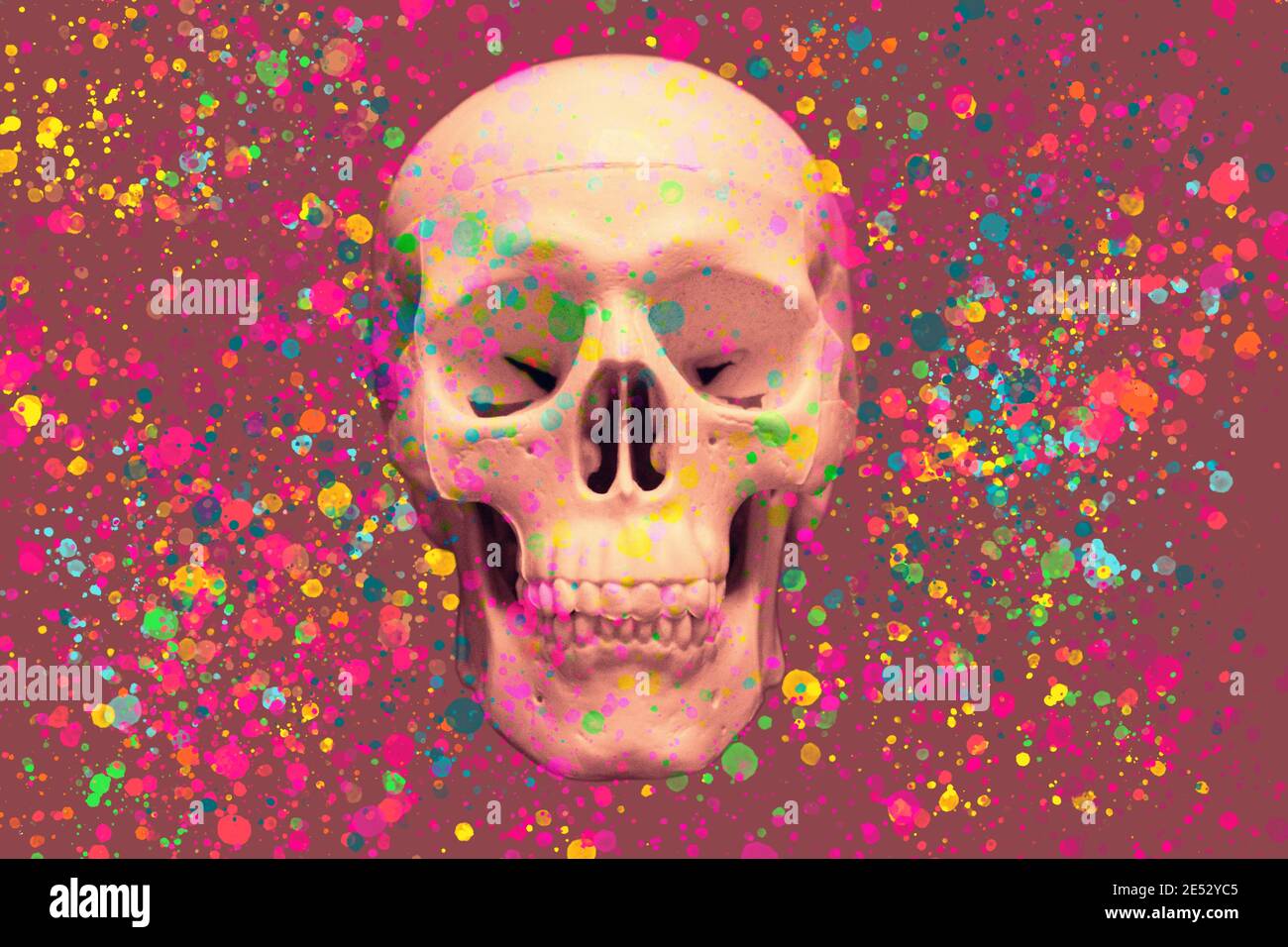 Small model skull with paint splater background Stock Photo - Alamy