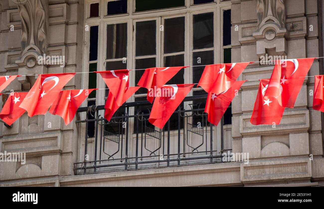 Turkish national flag hang on a pole on a rope in the street in open ...