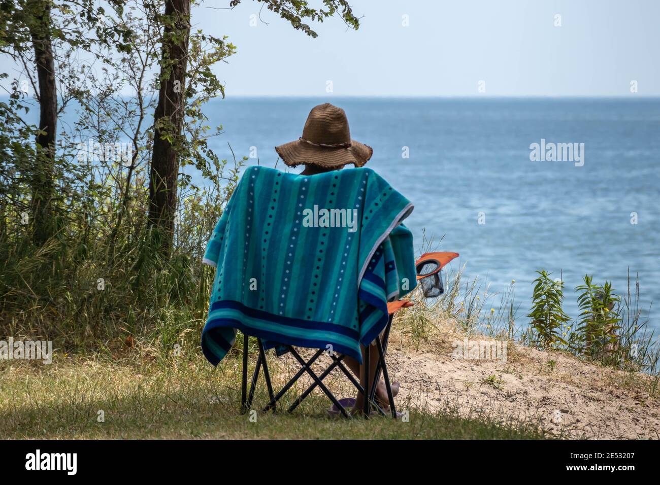 Woman beach chair behind hi-res stock photography and images - Alamy