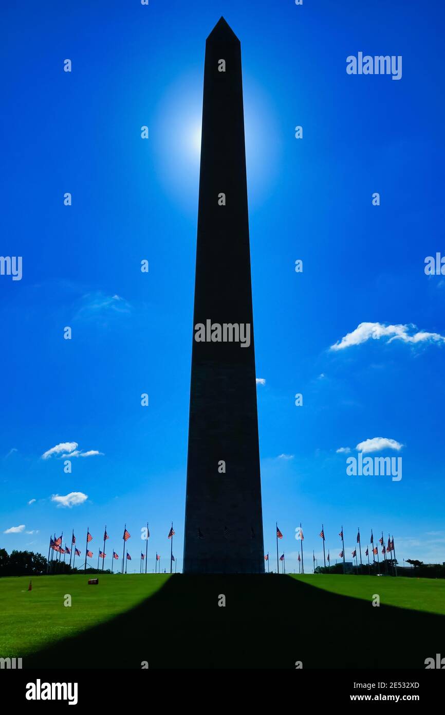 The Washington Monument casting a shadow on a sunny day Stock Photo - Alamy