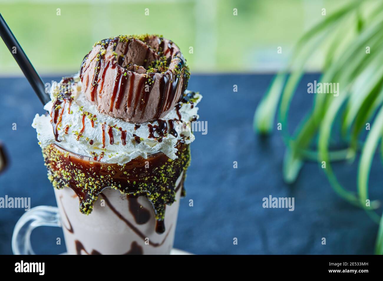 Milkshake with cone, chocolate , sprinkles in the green background Stock Photo - Alamy