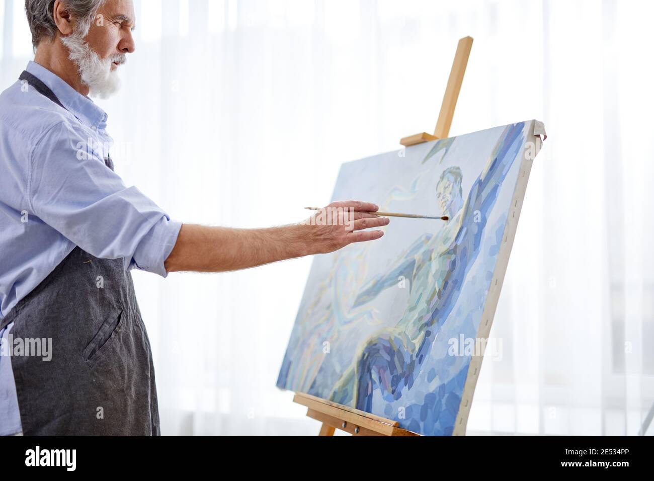 artist painter man painting picture on canvas. happy retirement ...
