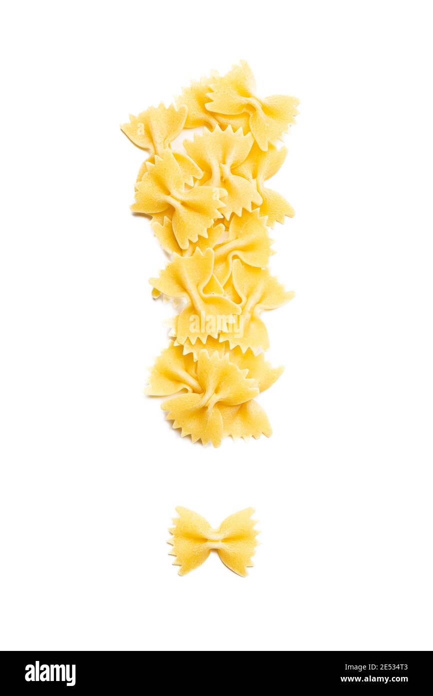 exclamation mark from dry farfalle pasta on a white isolated background ...