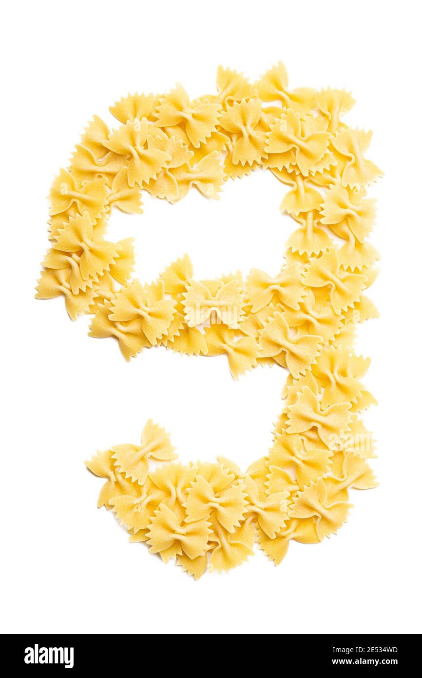 Arabic numeral "9" from dry farfalle pasta on a white isolated ...