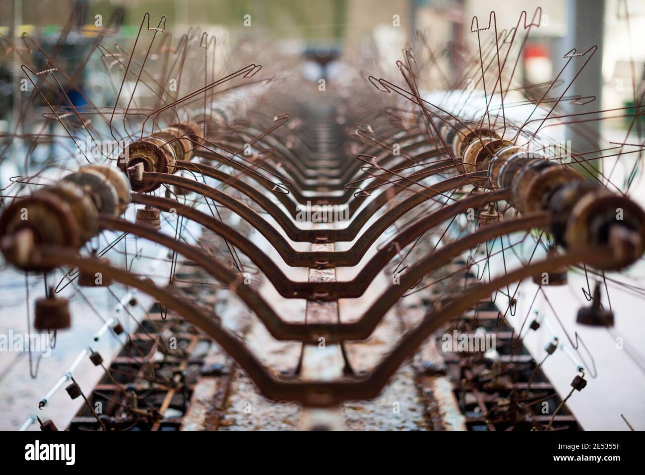 Symmetrical close up an old and rusty loom in and old and abandoned ...