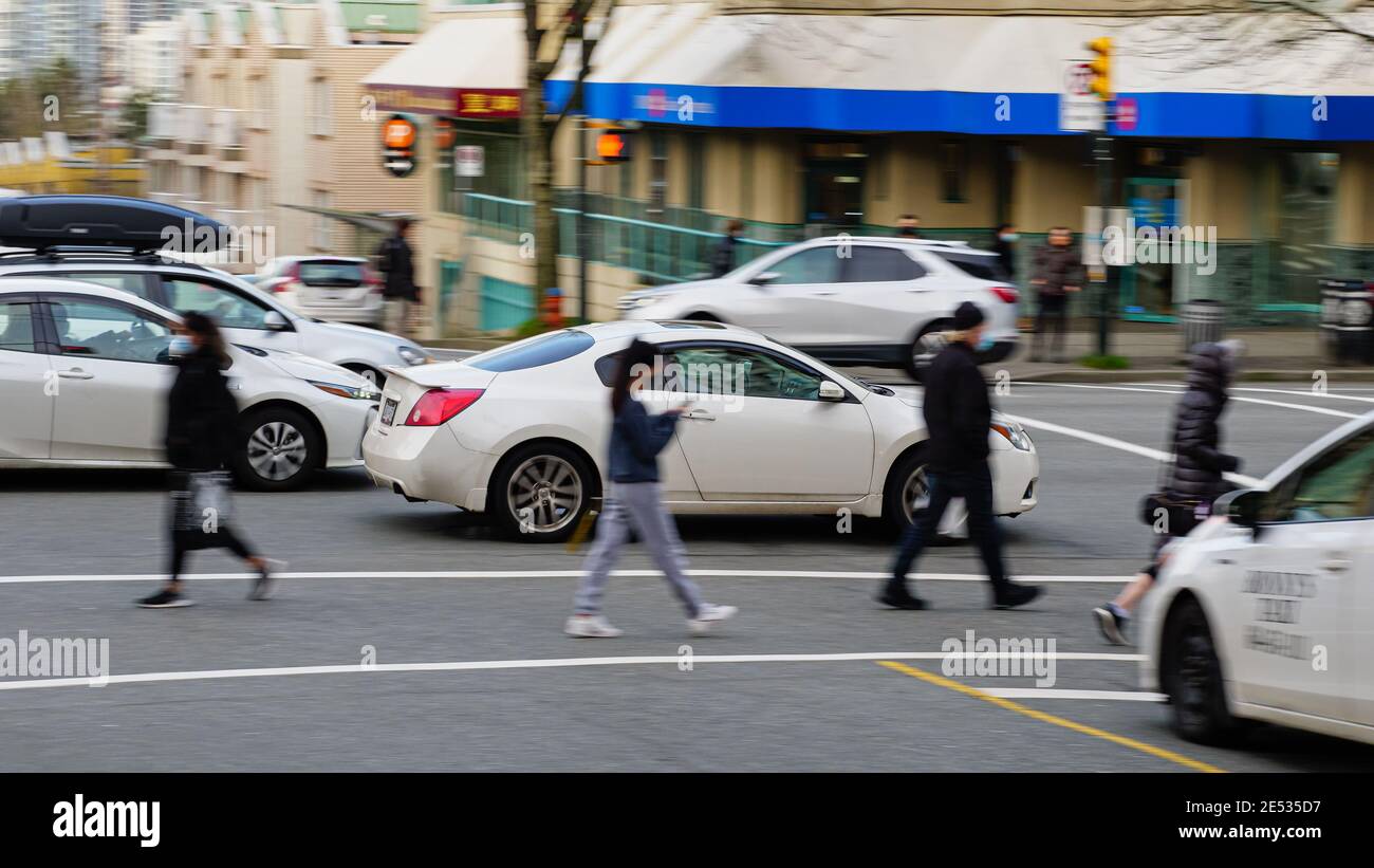 Vancouver, British Columbia, Canada. 7th Jan, 2021. Pedestrian and car ...