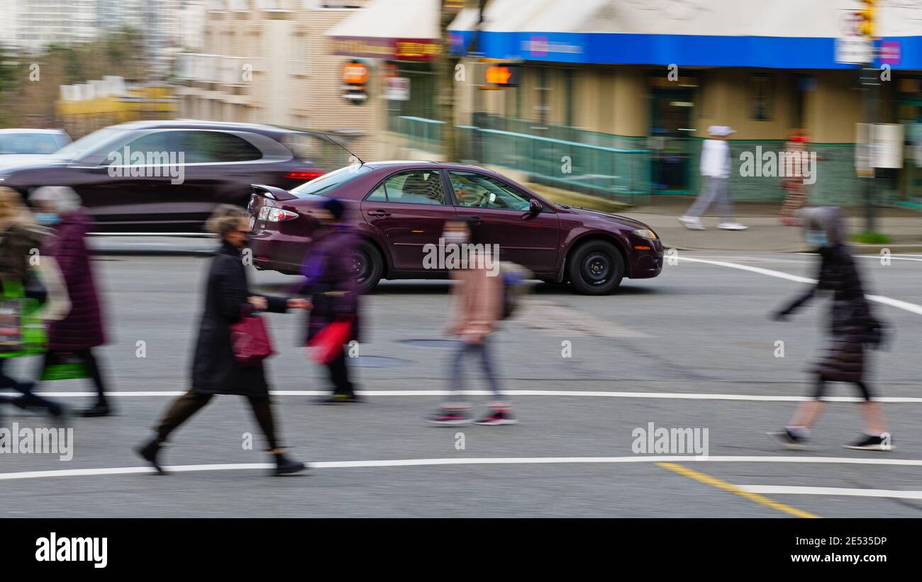 Vancouver, British Columbia, Canada. 7th Jan, 2021. Pedestrian and car ...
