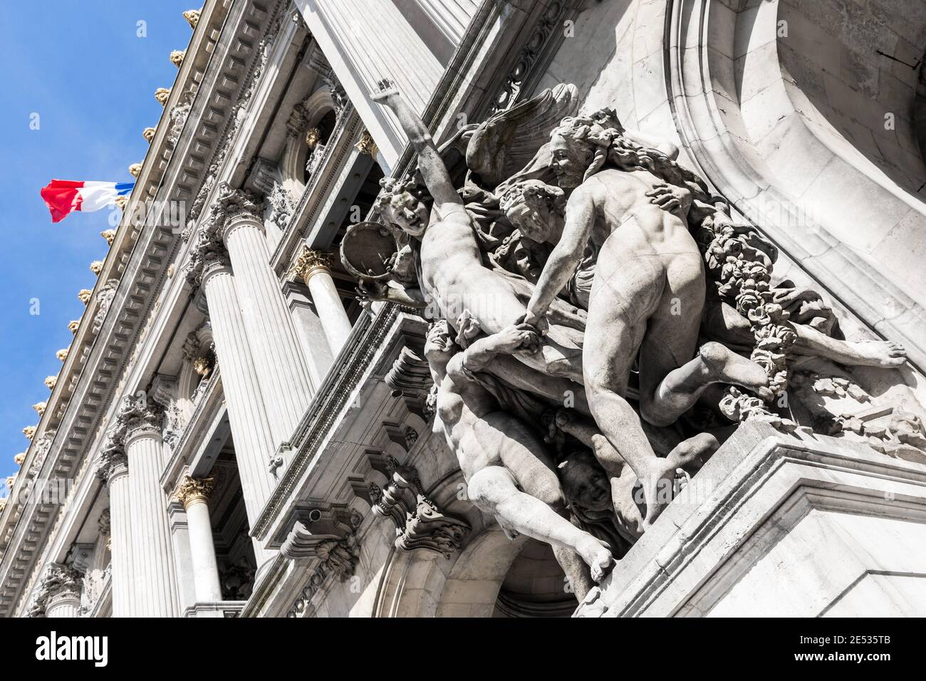 Close up of a group of marble statues on the facade of a french ...