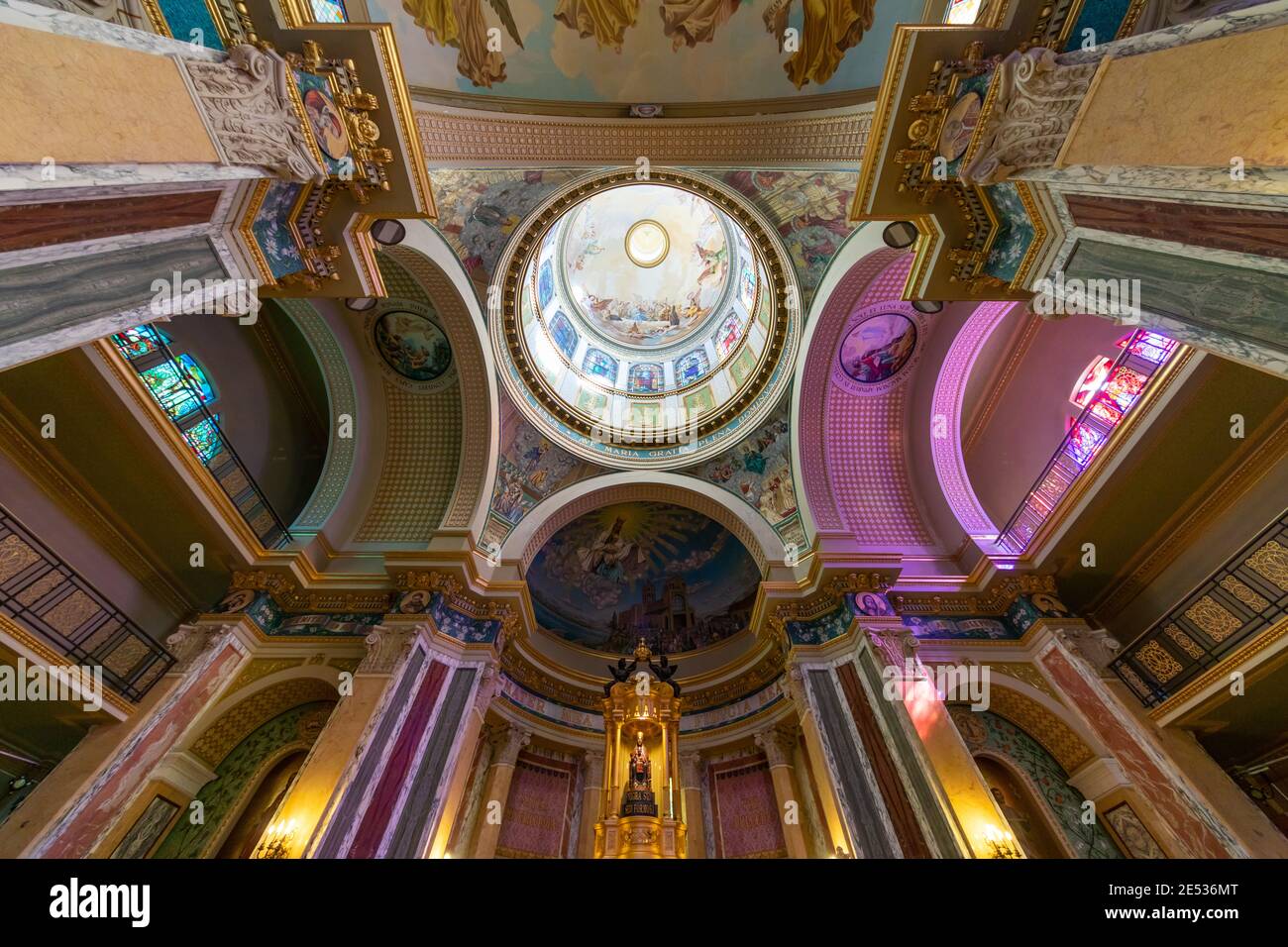Symmetrical wide angle view of the apse of a colorful baroque Sicilian ...