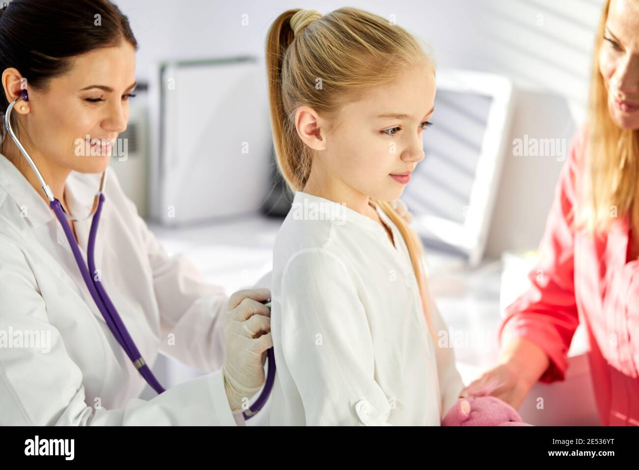 girl visiting doctor.female pediatrician checking little patient's ...
