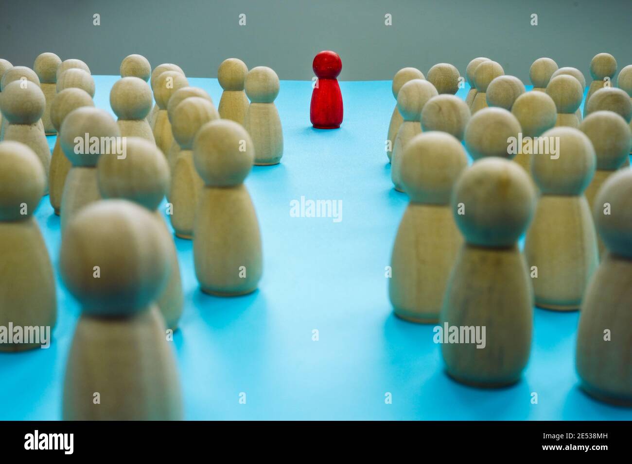 Unique figure stand out of the crowd as symbol of individuality and ...