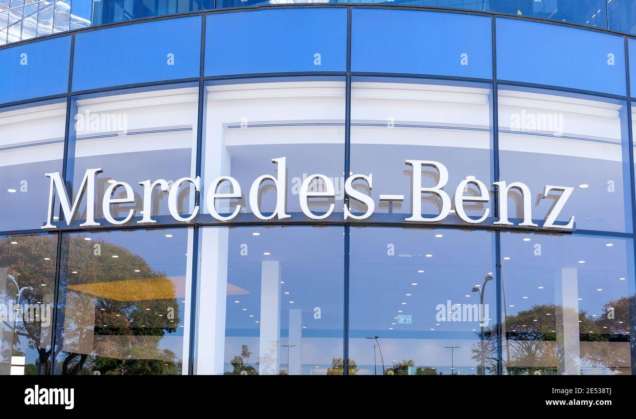 Mercedes Benz sign on a local dealership building windows Stock Photo ...