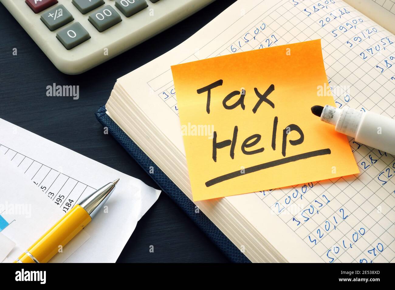 Tax help memo and financial calculations with calculator Stock Photo ...