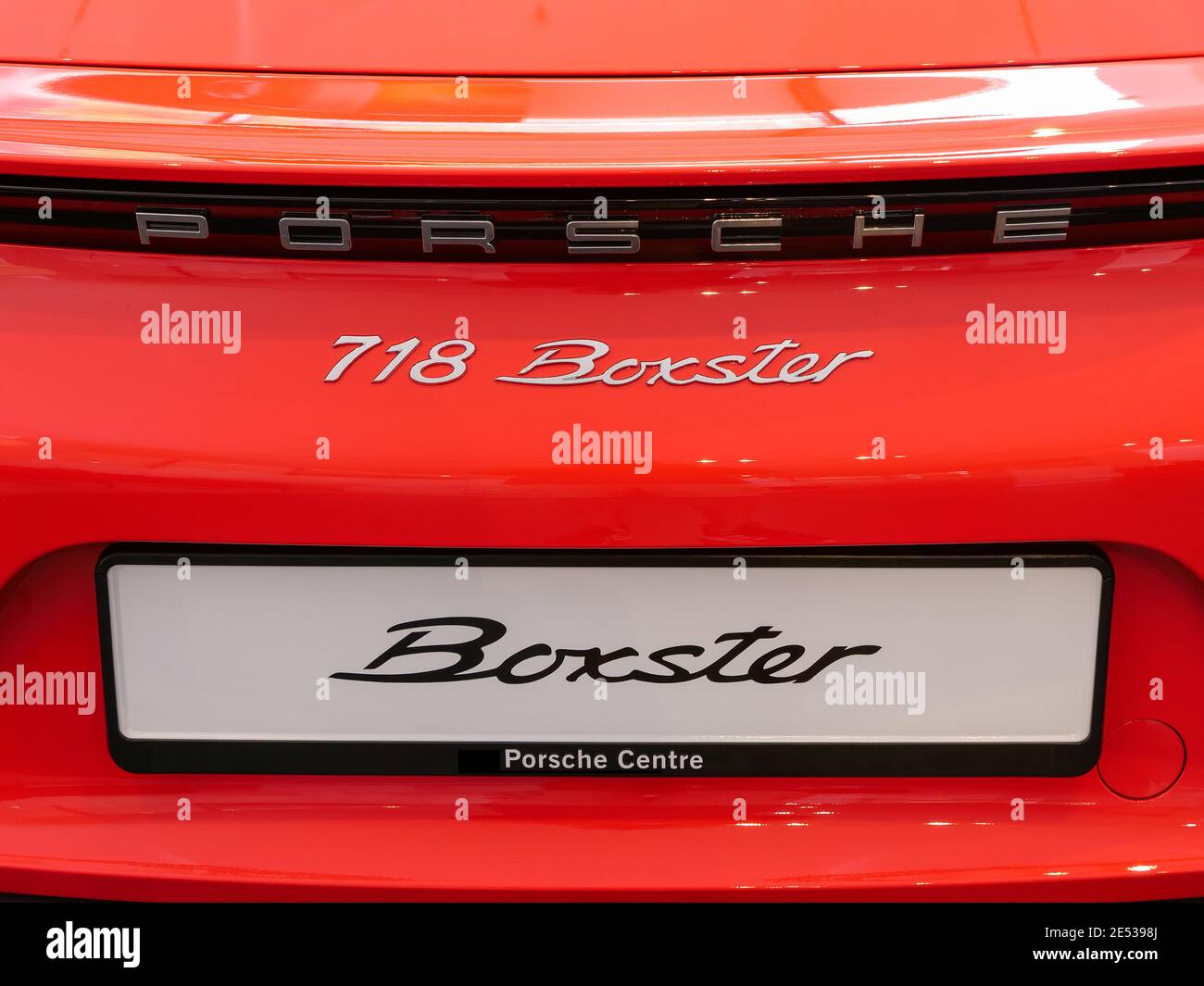 Bright Orange Porsche 718 Boxter rear end with emblems Stock Photo - Alamy