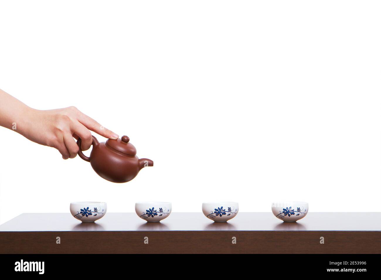 A hand in pouring tea closeup high quality photo Stock Photo - Alamy