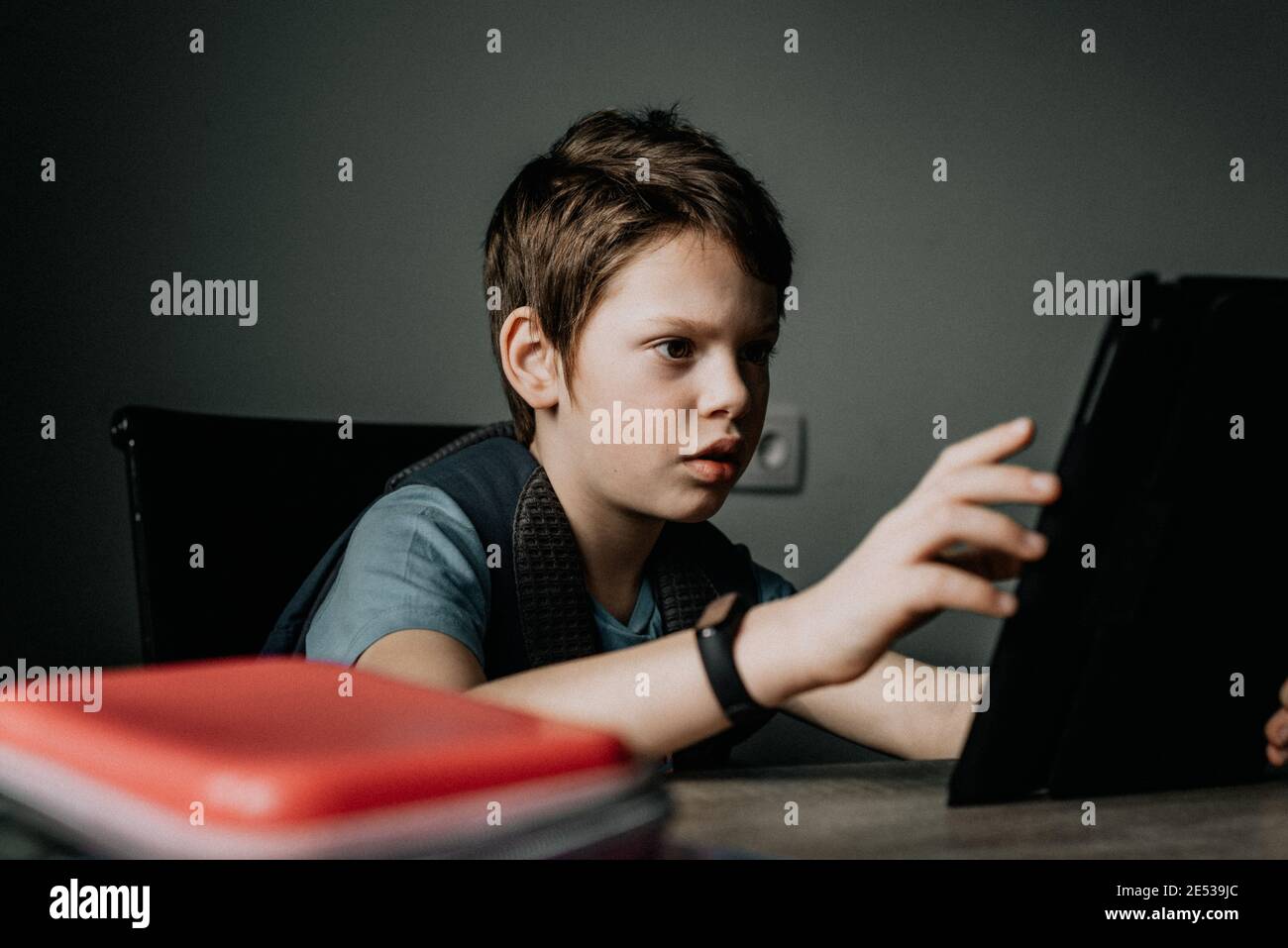 School boy playing tablet at home, growing up with technology Stock ...