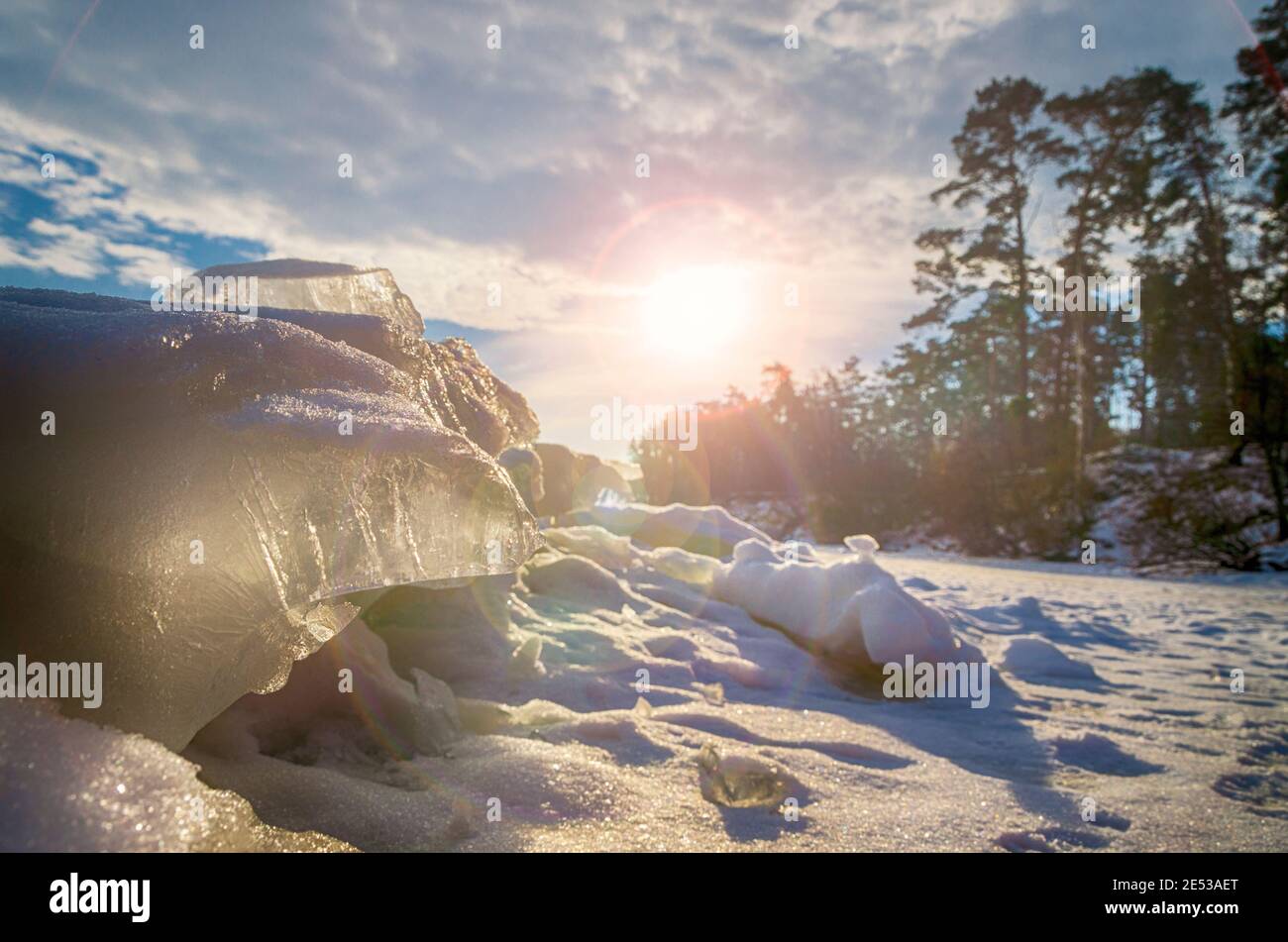 Sun shining through the ice hammocks on the frozen sea shore Stock ...