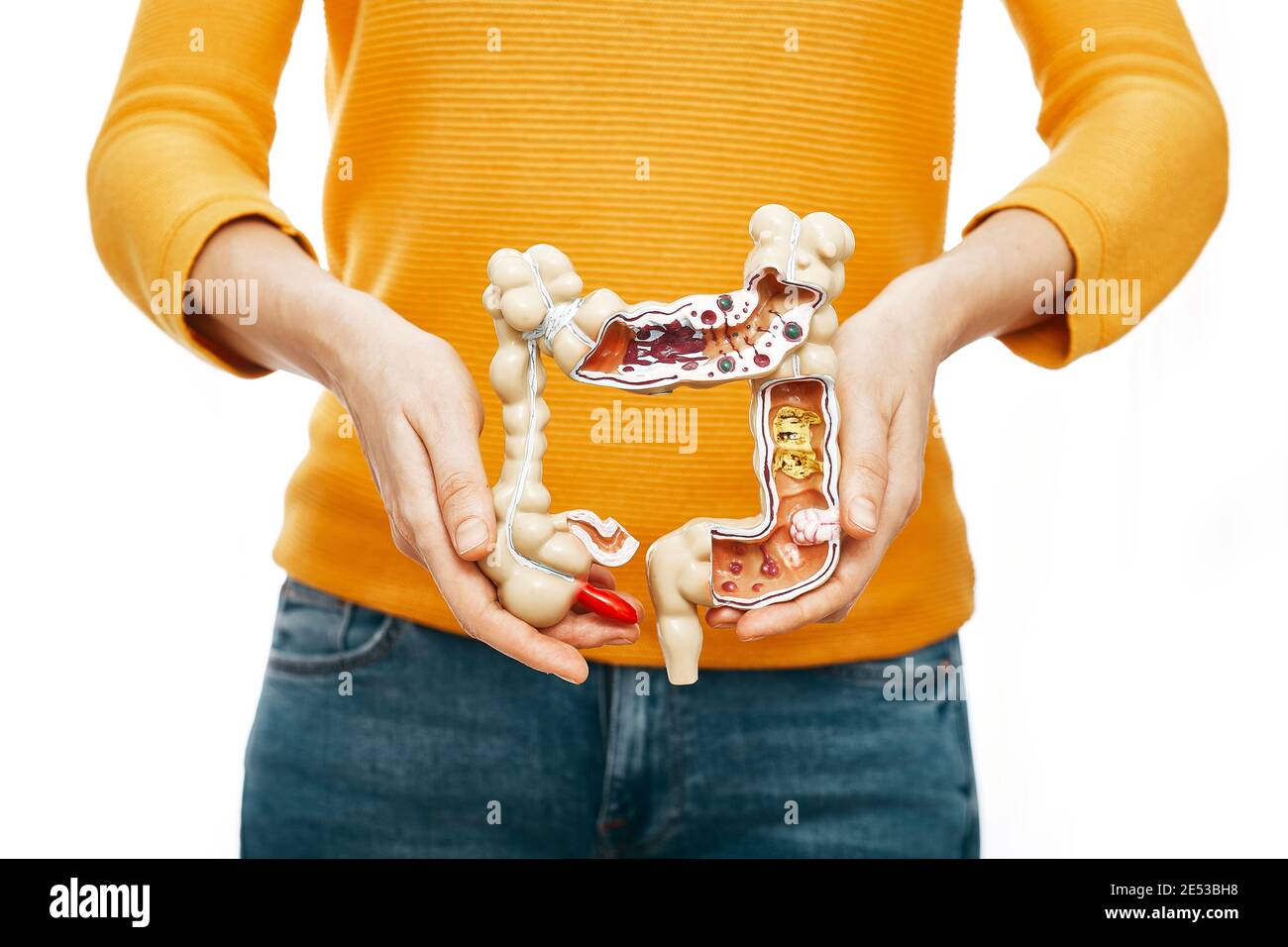 Treatment of colitis, flatulence, indigestion. Woman holds in front of ...