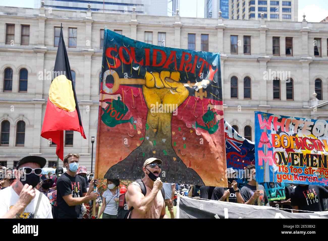 Protesters display flags at Queens Gardens during the demonstration ...