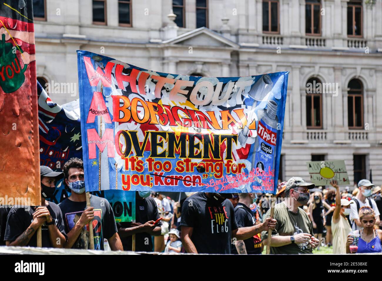 Protesters display a flag at Queens Gardens during the demonstration ...